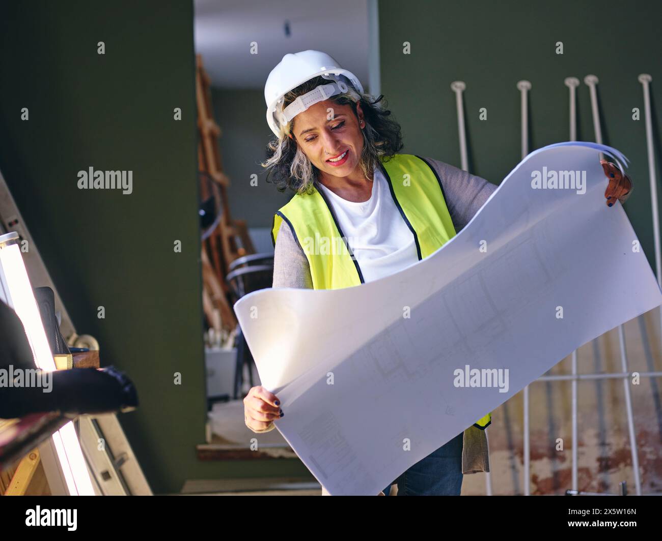 Woman construction blueprint in hi-res stock photography and images - Alamy