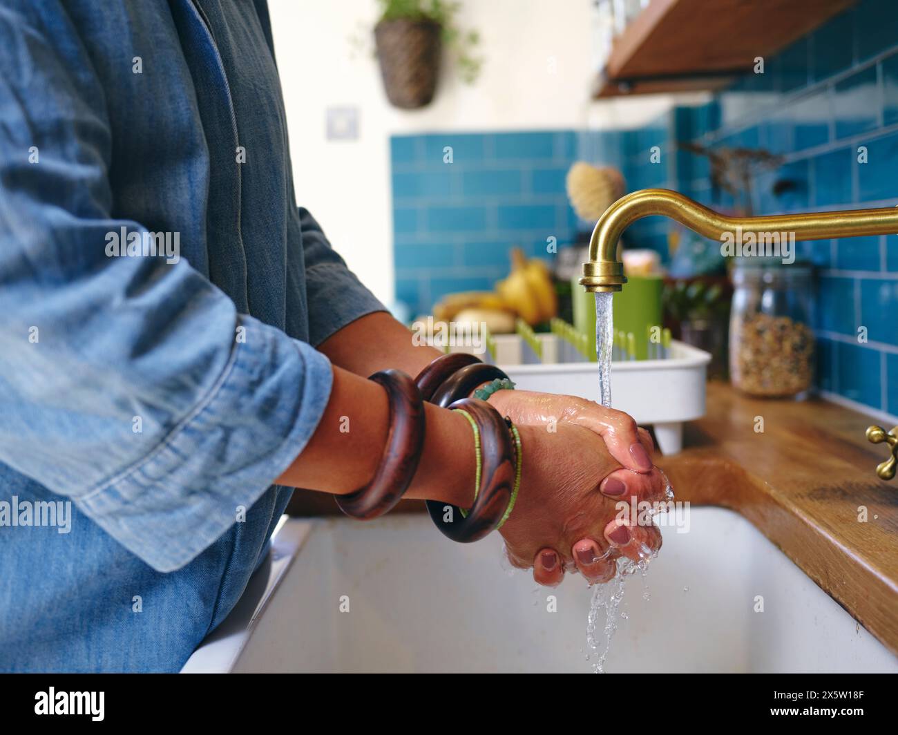 Woman washing hands close hi-res stock photography and images - Alamy