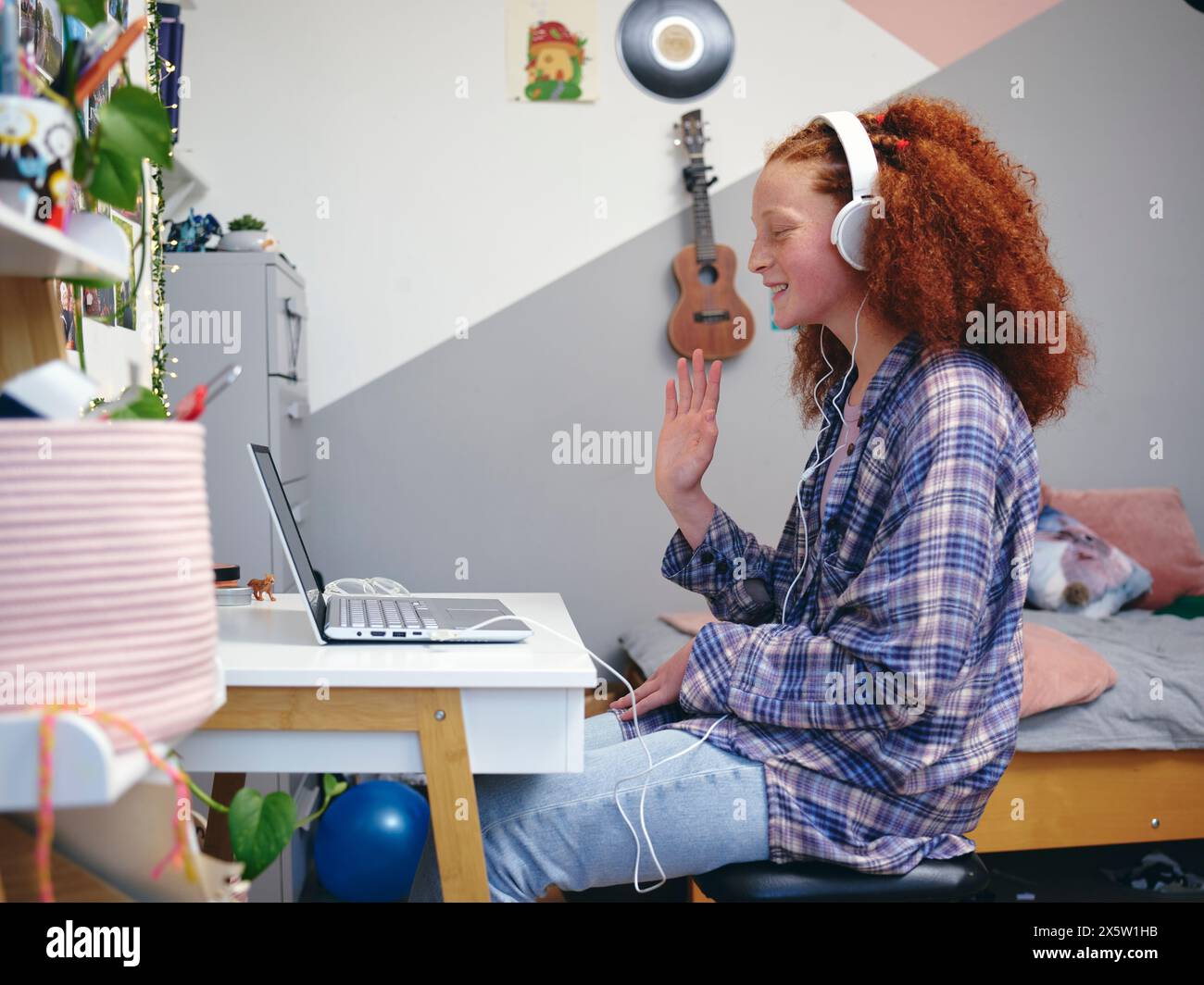 Girl using headphones and a laptop hi-res stock photography and images ...