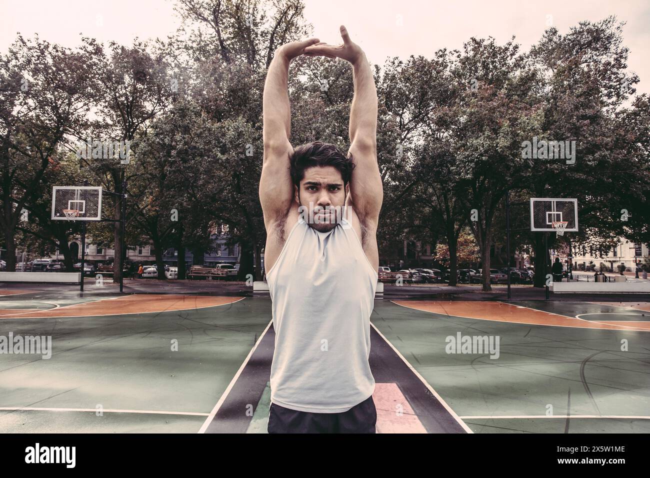 Muscular man stretching arms in hi-res stock photography and images - Alamy