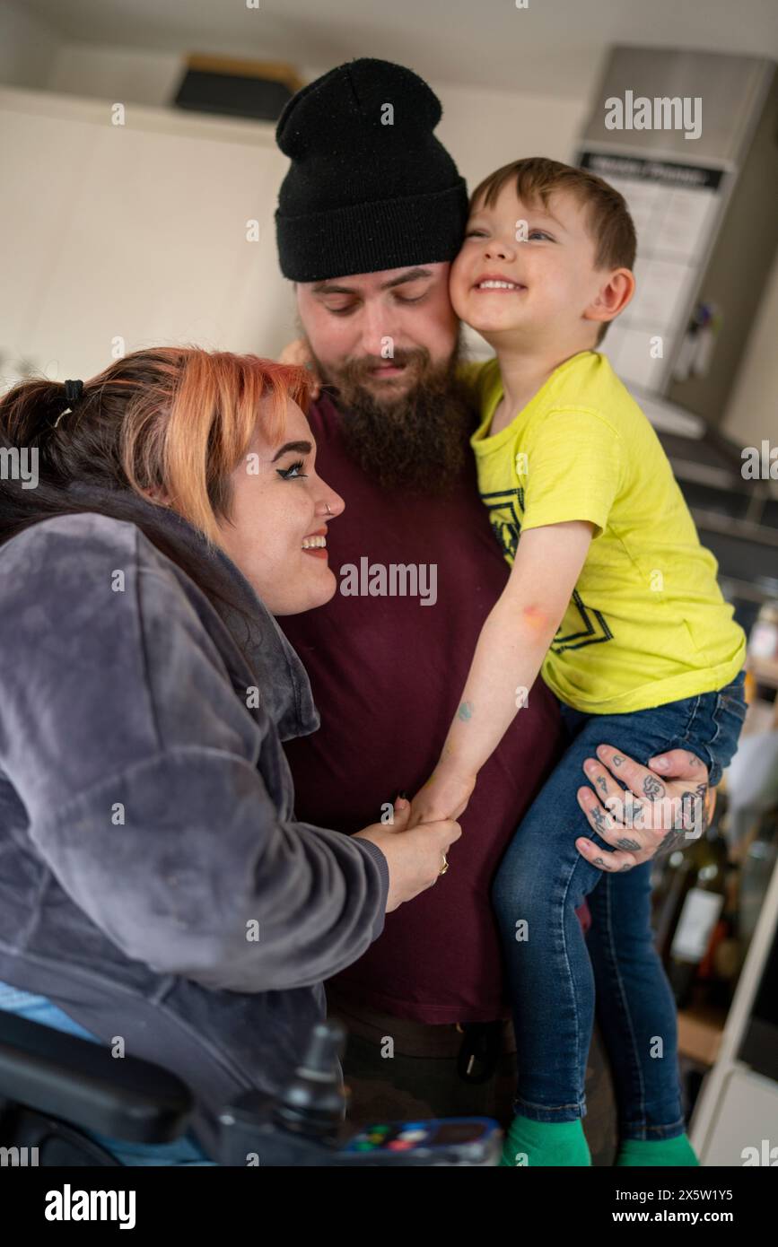 Smiling family with son Stock Photo - Alamy