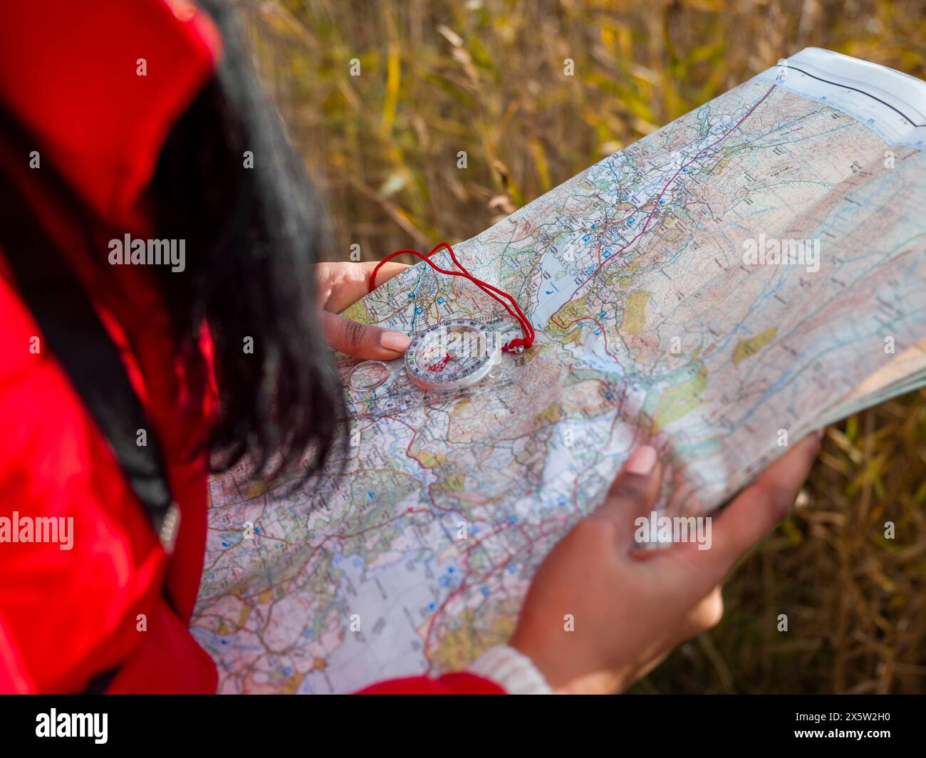 Female hiker using map and compass Stock Photo - Alamy Female hiker using map and compass Stock Photo - Alamy
