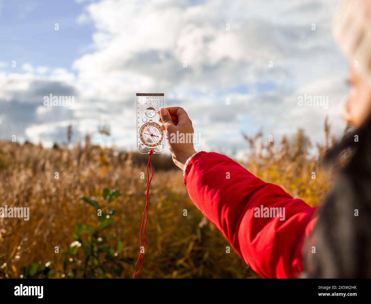 Female hiker using compass Stock Photo - Alamy Female hiker using compass Stock Photo - Alamy