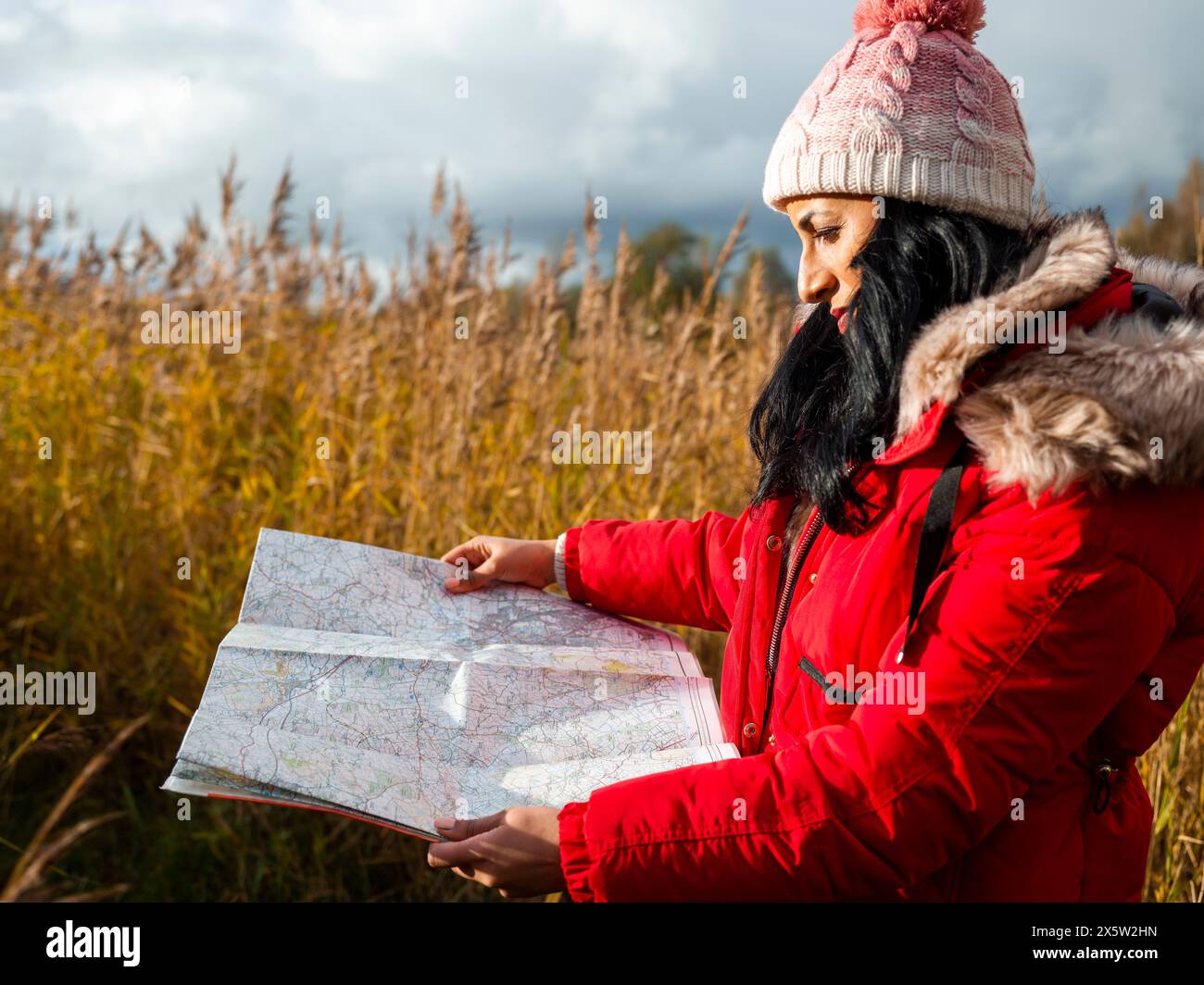 Female hiker using map Stock Photo - Alamy