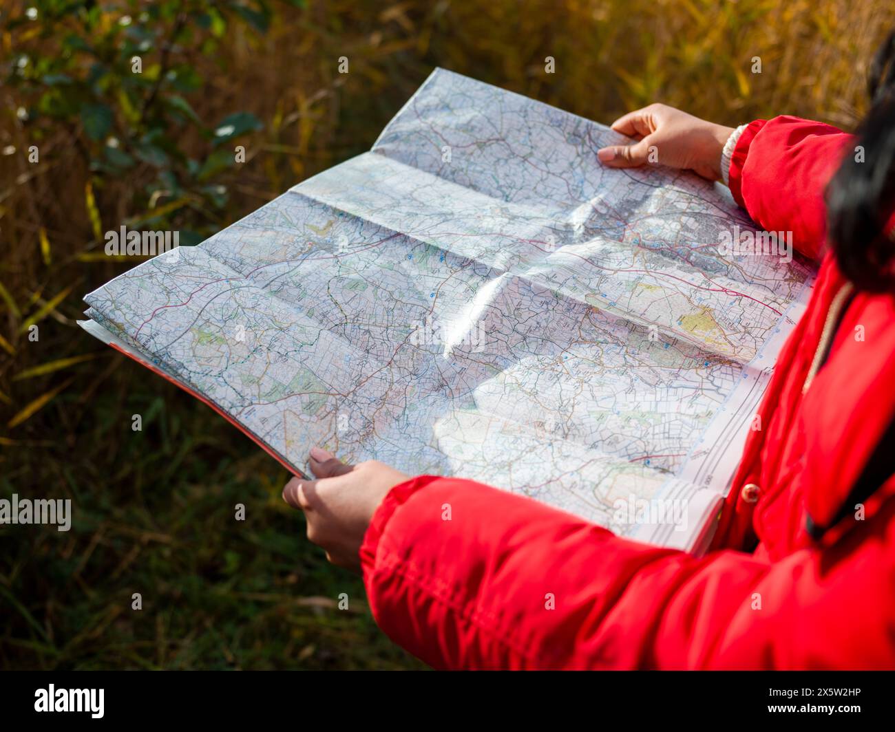 Female hiker using map Stock Photo - Alamy