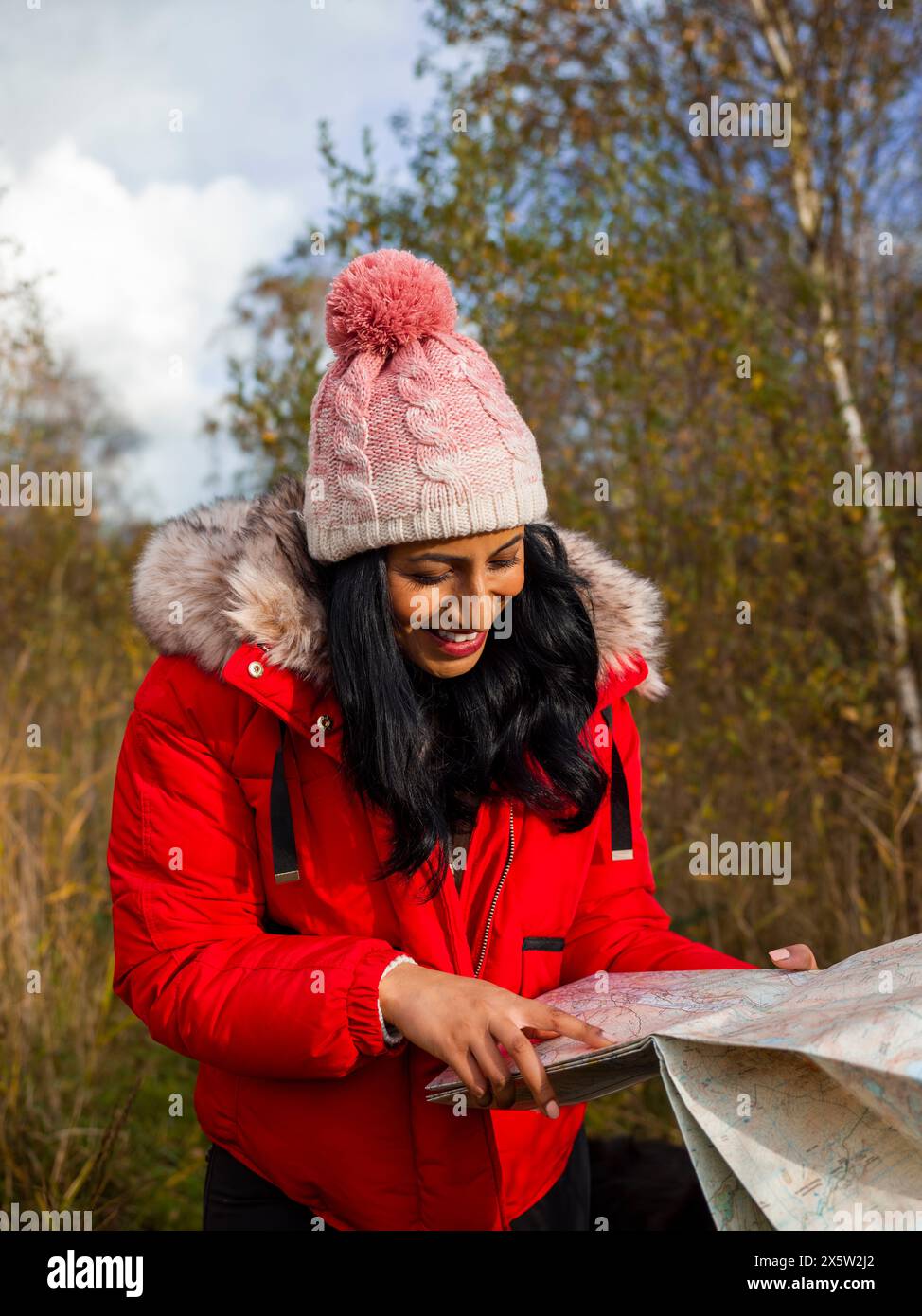 Female hiker using map Stock Photo - Alamy
