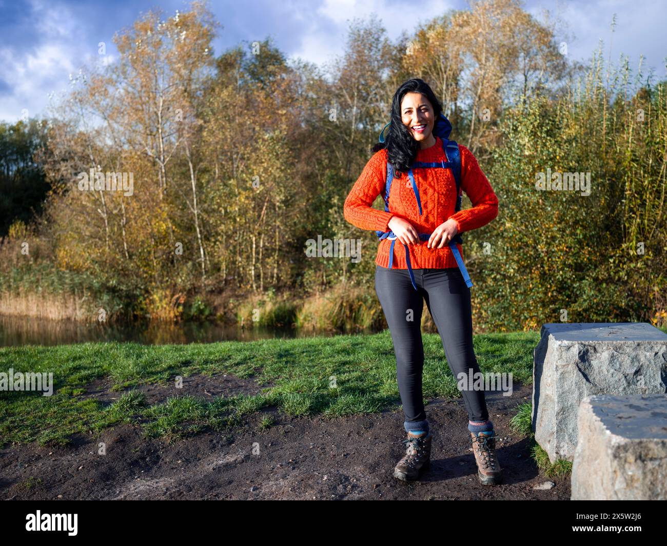 Female hiker smiling at camera hi-res stock photography and images - Alamy