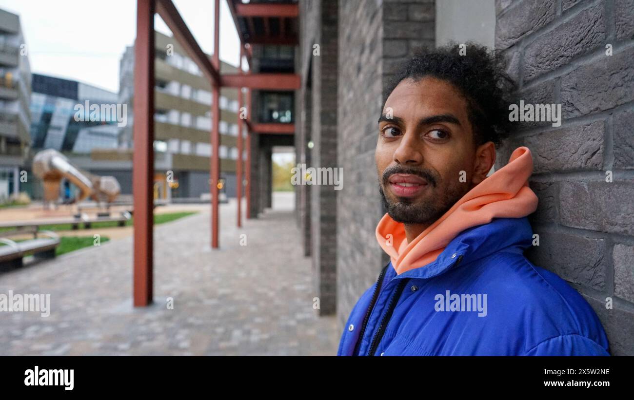 Young man wearing blue jacket hi-res stock photography and images - Alamy