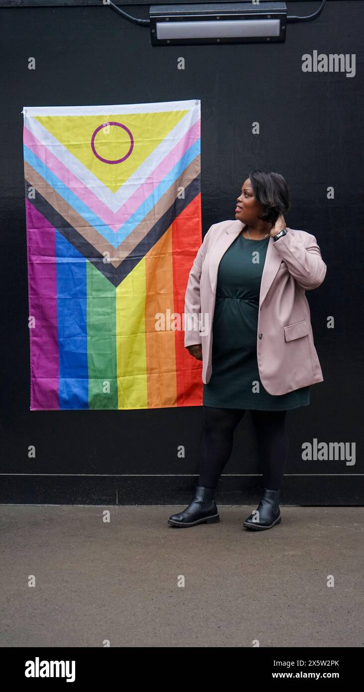 Mature woman in front of pride flag Stock Photo - Alamy