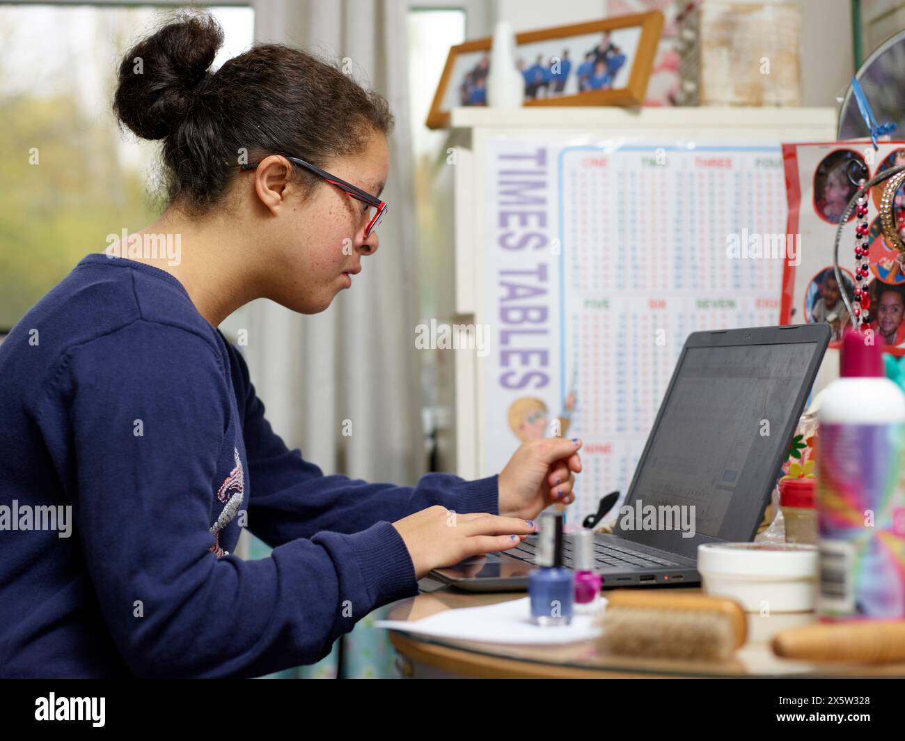 Girl with Down syndrome using laptop Stock Photo - Alamy