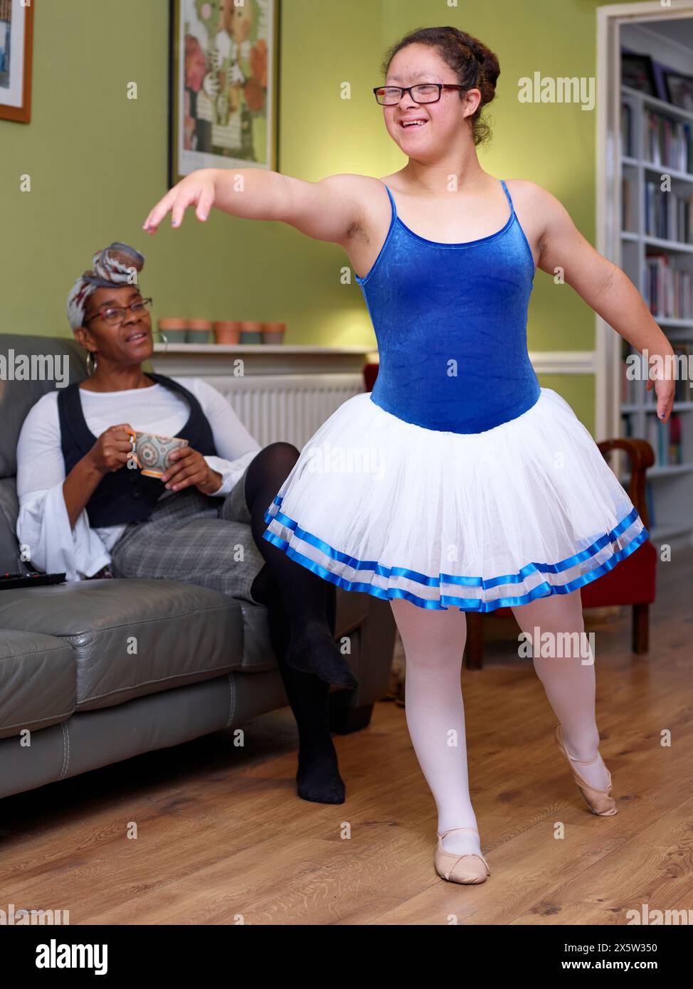 Mother watching daughter with Down syndrome dance ballet Stock Photo ...