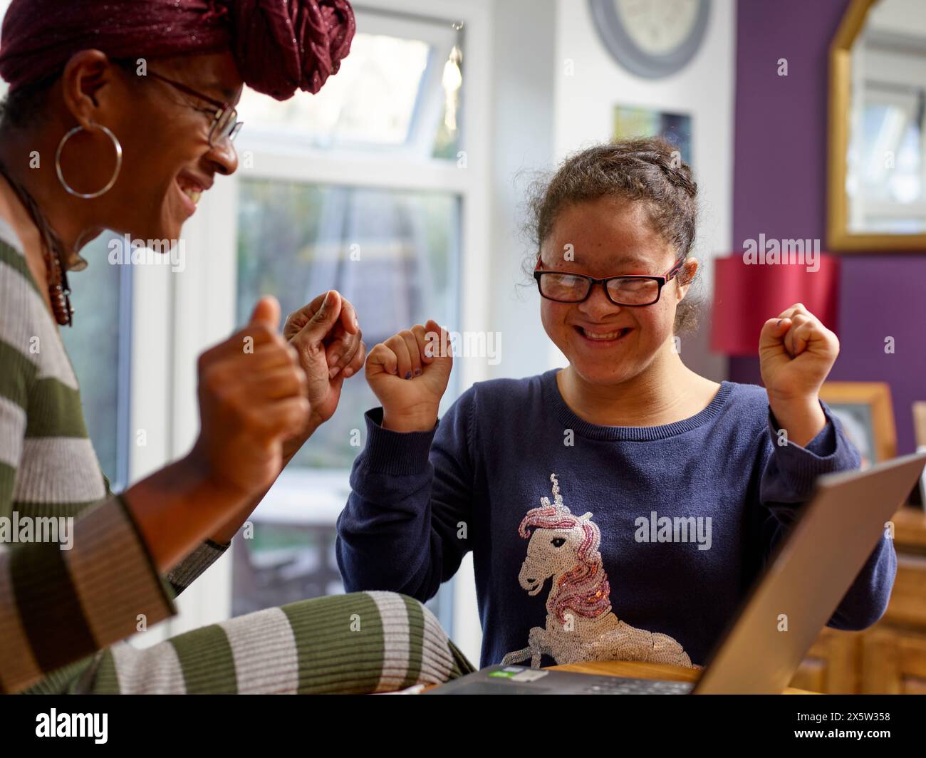 Mother and daughter with Down syndrome celebrating Stock Photo - Alamy