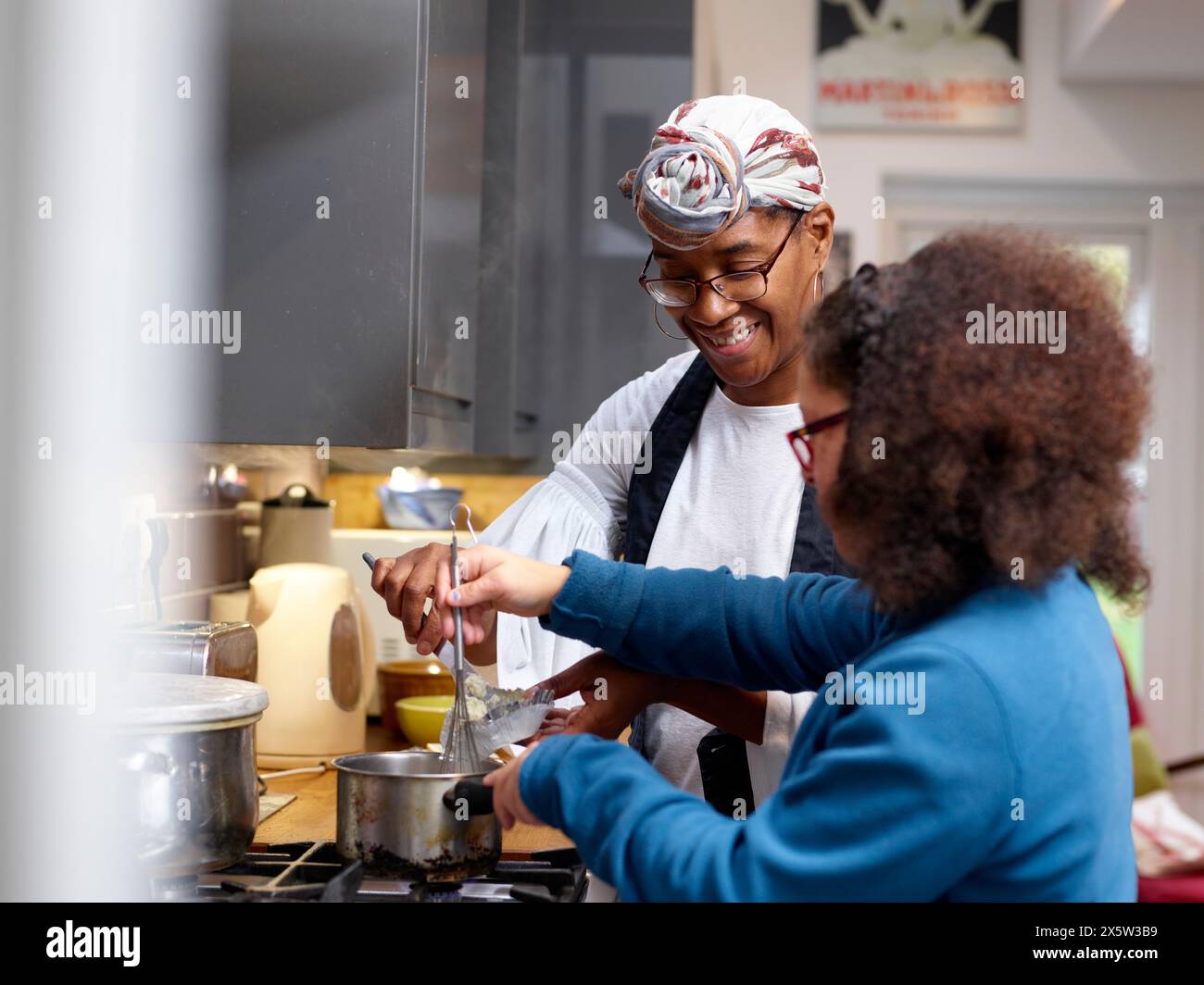 Mother with daughter (16-17) with Down Syndrome cooking together Stock ...