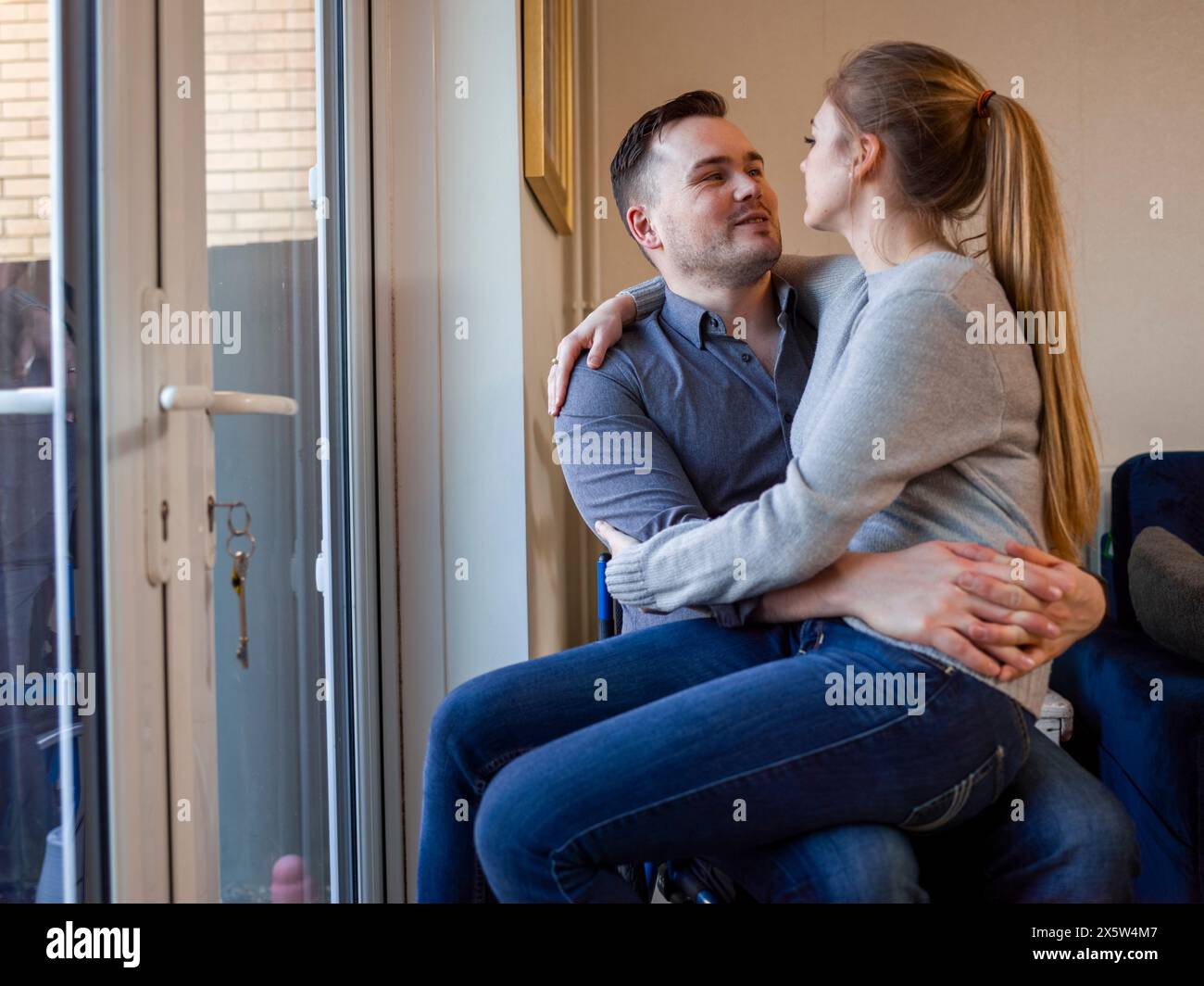 Mid adult man woman window hi-res stock photography and images - Alamy