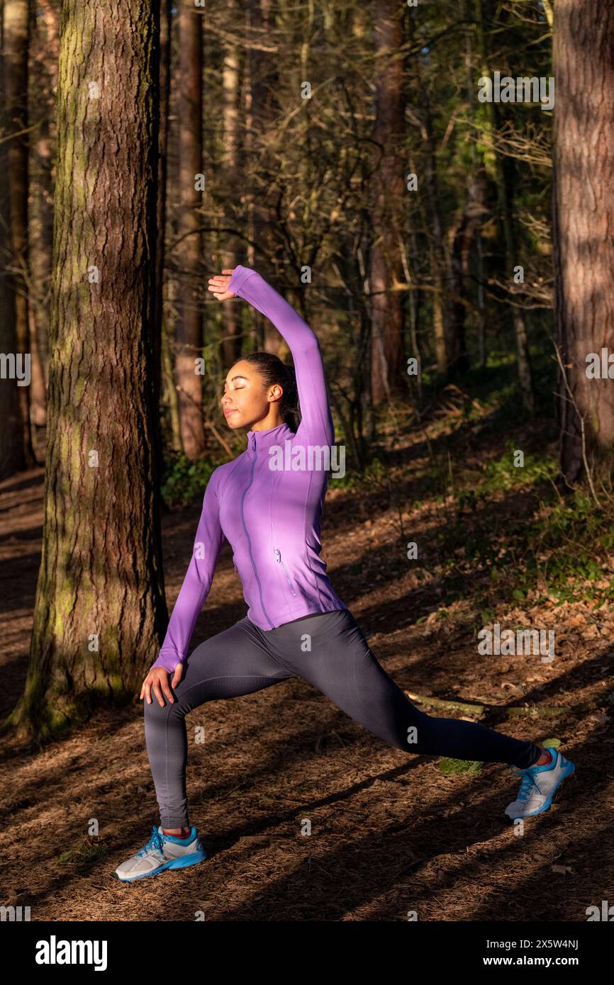 Woman stretching in nature hi-res stock photography and images - Alamy