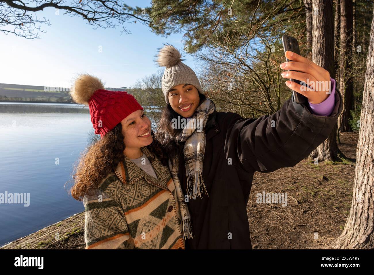 Female friends taking selfie at lake Stock Photo - Alamy Female friends taking selfie at lake Stock Photo - Alamy