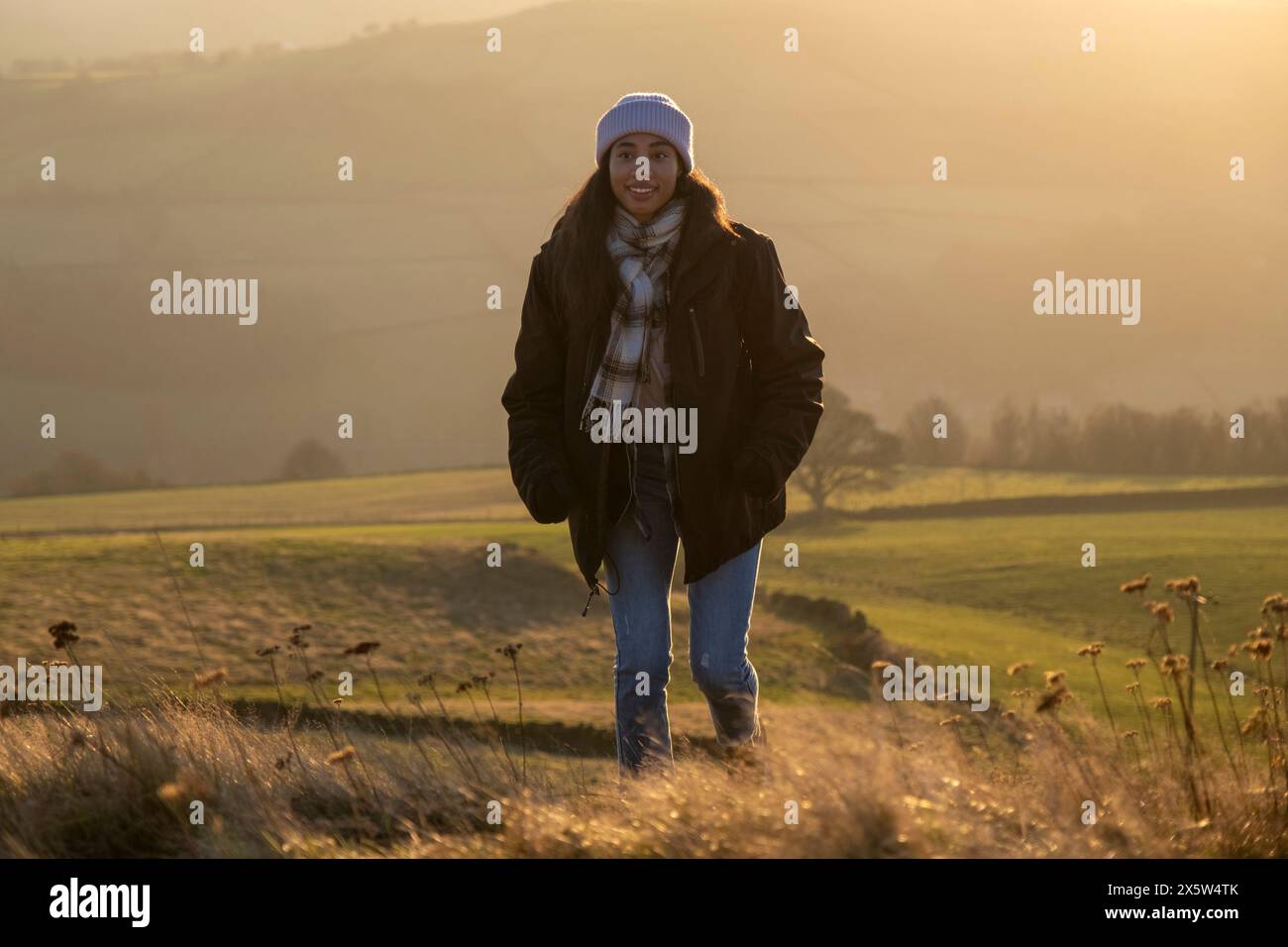 Female alone walking in grass hi-res stock photography and images - Alamy