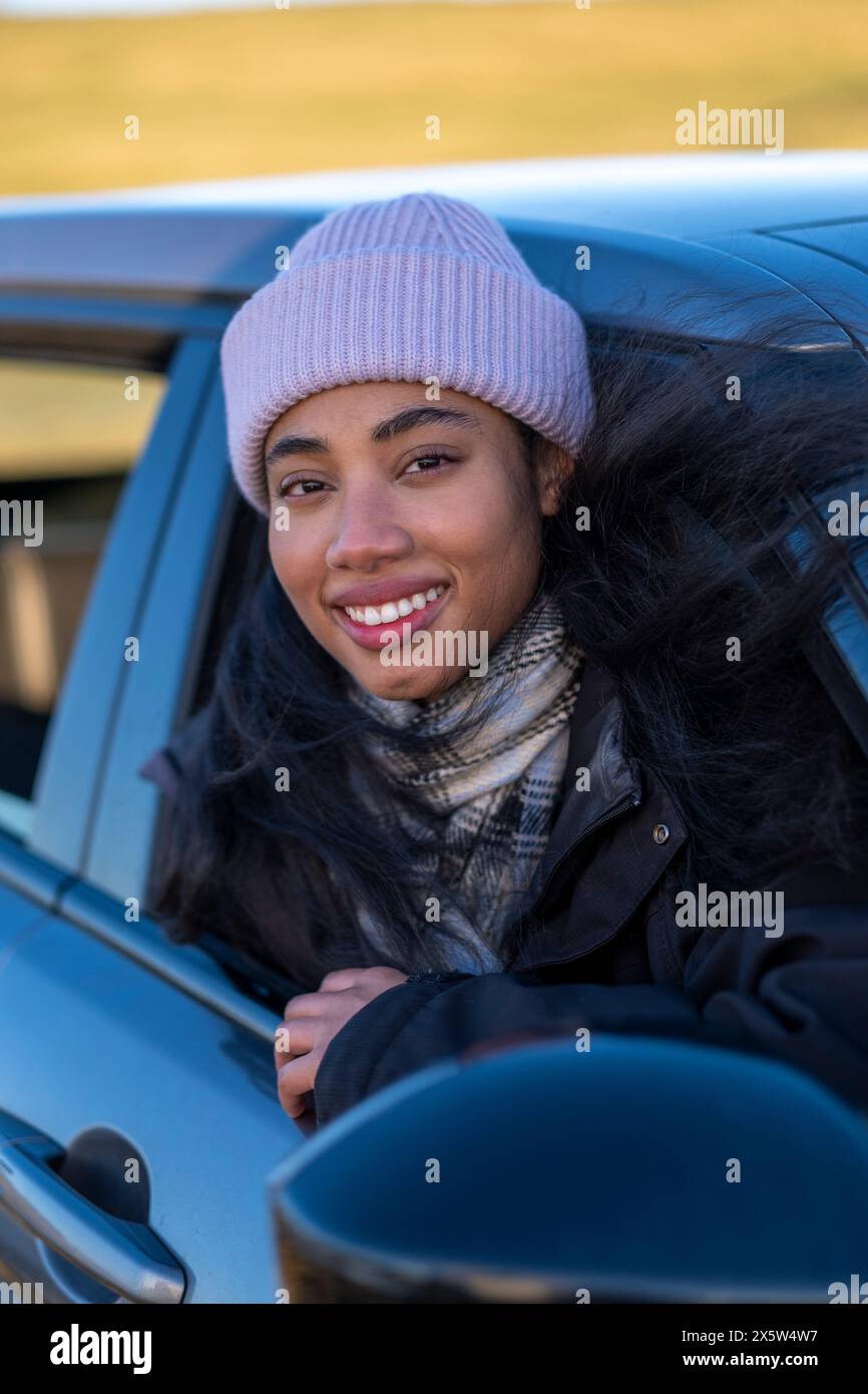 Woman looking out window uk hi-res stock photography and images - Alamy