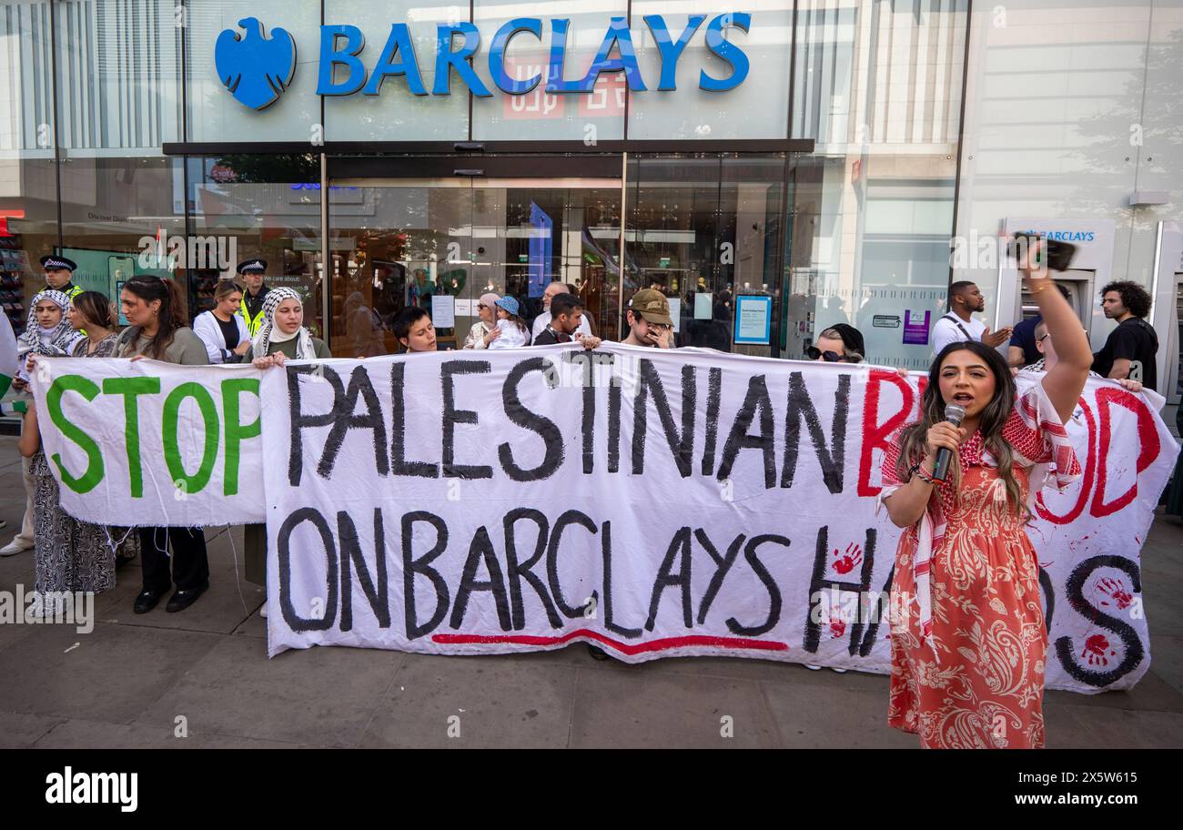 Manchester, UK. 11th May, 2024. Young woman with a protest banner ...