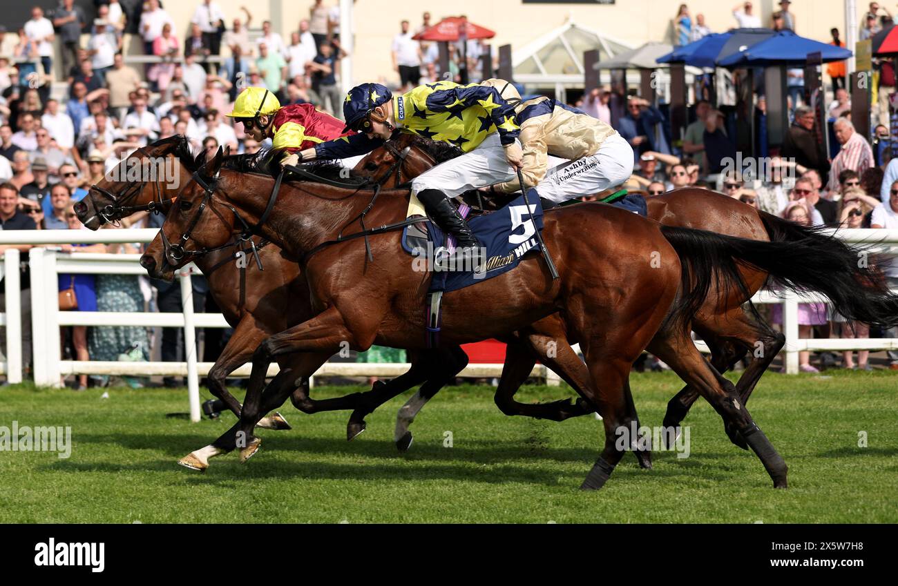Great Generation (left, rear) ridden by jockey Marco Ghiani on their ...