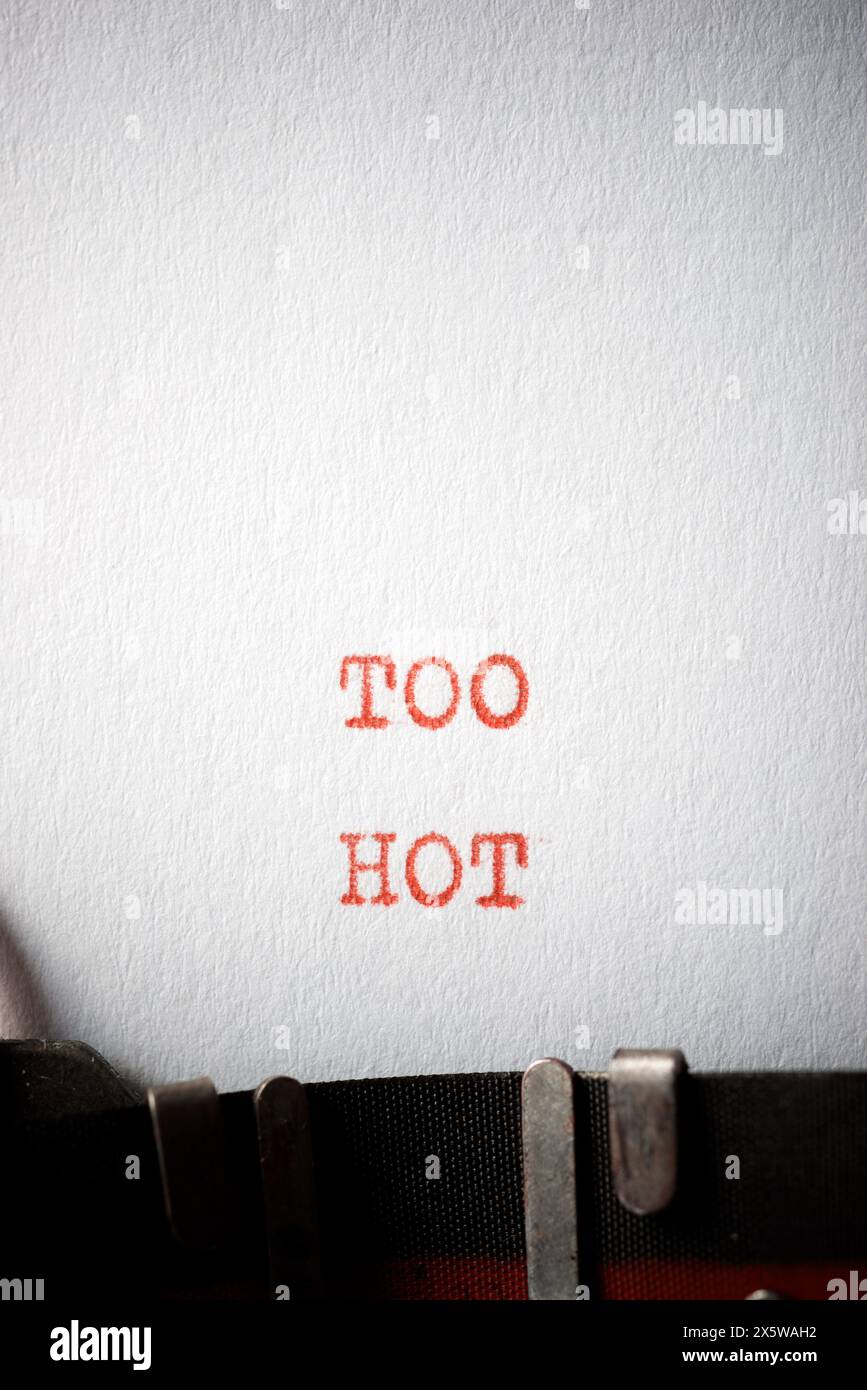 Too hot text written with a typewriter Stock Photo - Alamy