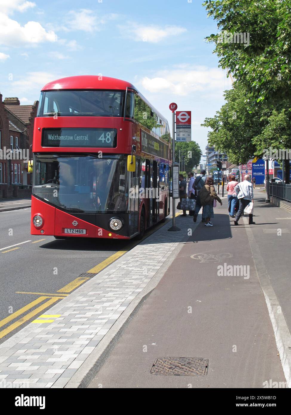 Passengers arriving at a 'floating' bus stop on Lee Bridge Road ...