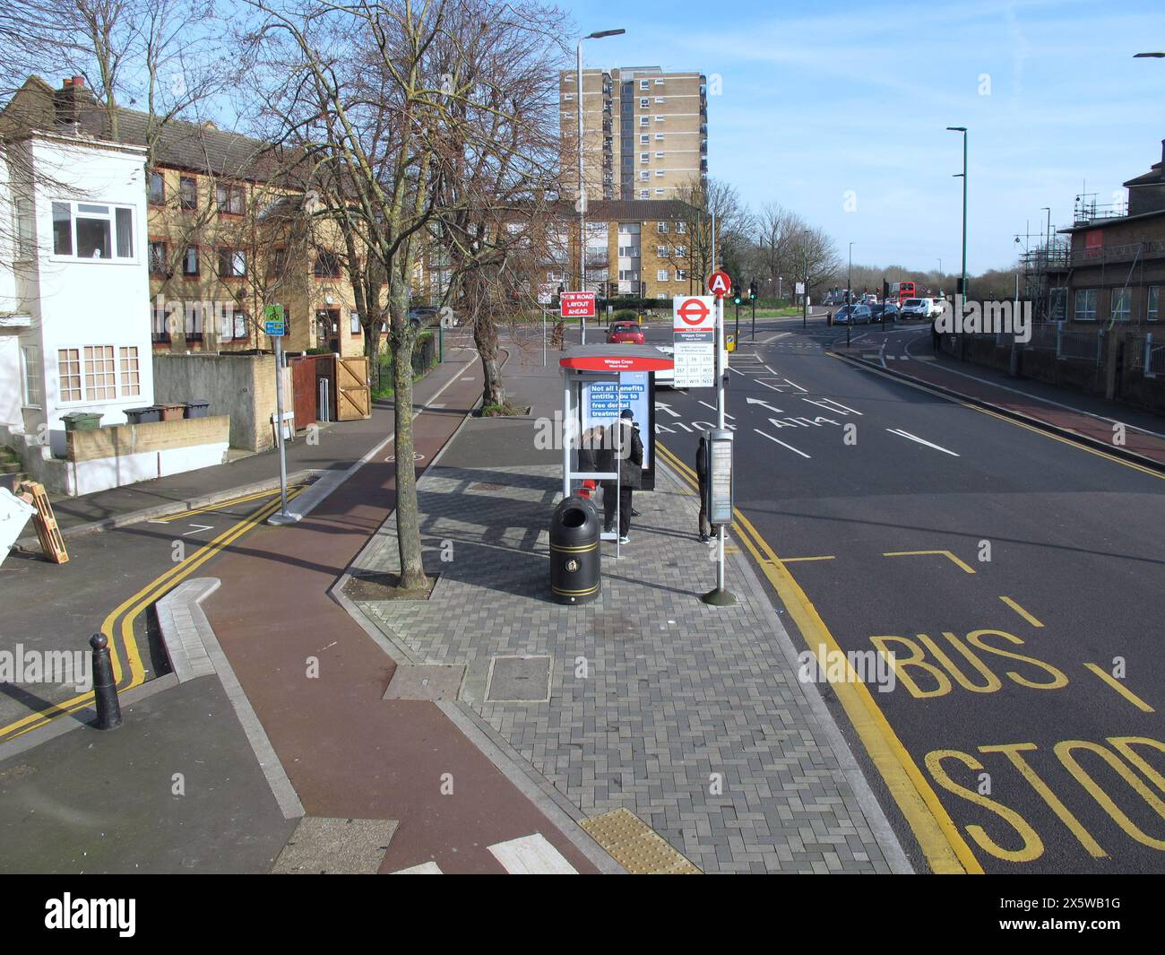 High level view of a 'floating' bus stop on Lee Bridge Road, Walthamstow, London. Cycle path ...