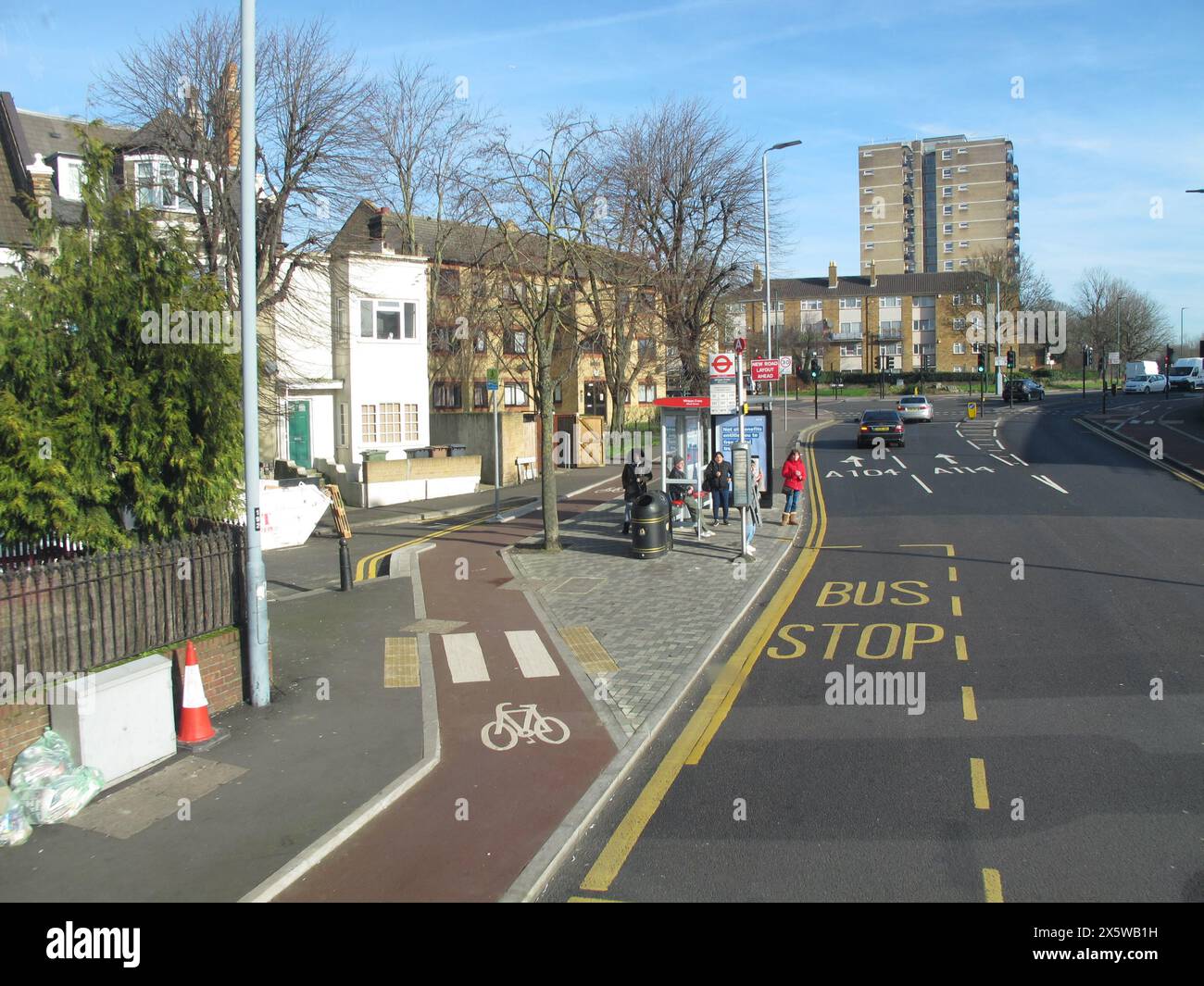 High level view of a 'floating' bus stop on Lee Bridge Road, Walthamstow, London. Cycle path ...