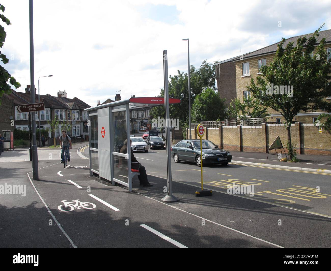 A cyclist approaches a 'floating' bus stop on Church Street, Leyton ...