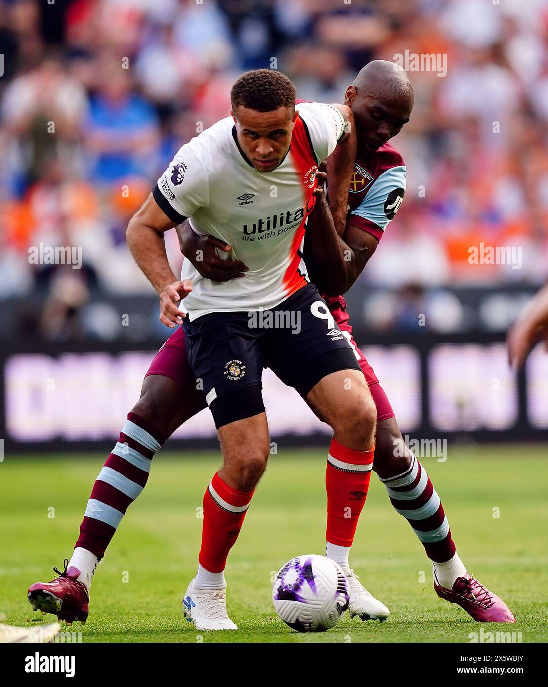Luton Town's Carlton Morris and West Ham United's Angelo Ogbonna (right ...