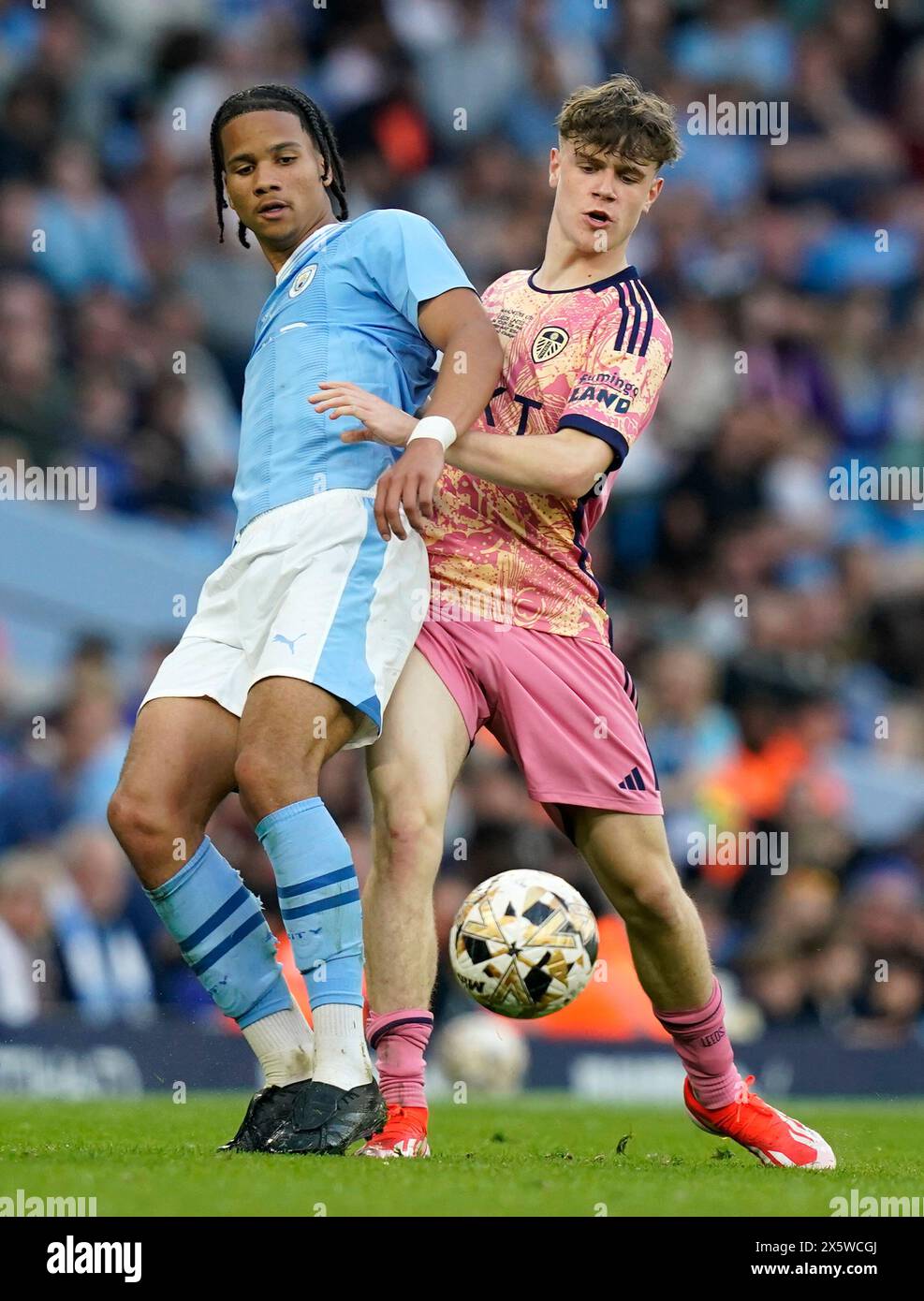 Manchester, UK. 10th May, 2024. Divine Mukasa of Manchester City (L) is ...