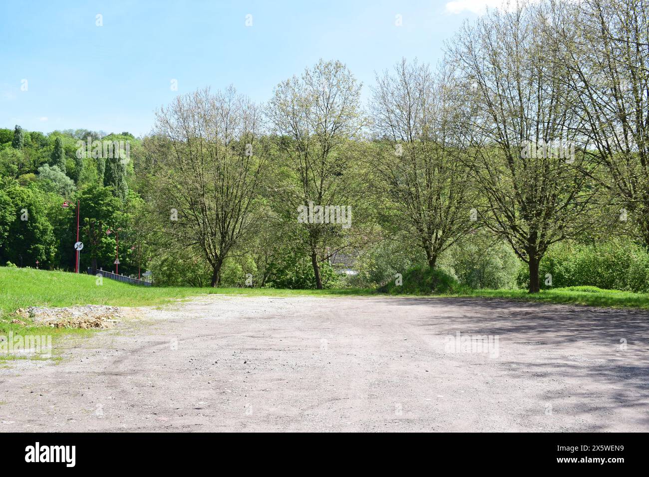 gravel parking lot in spring Stock Photo - Alamy