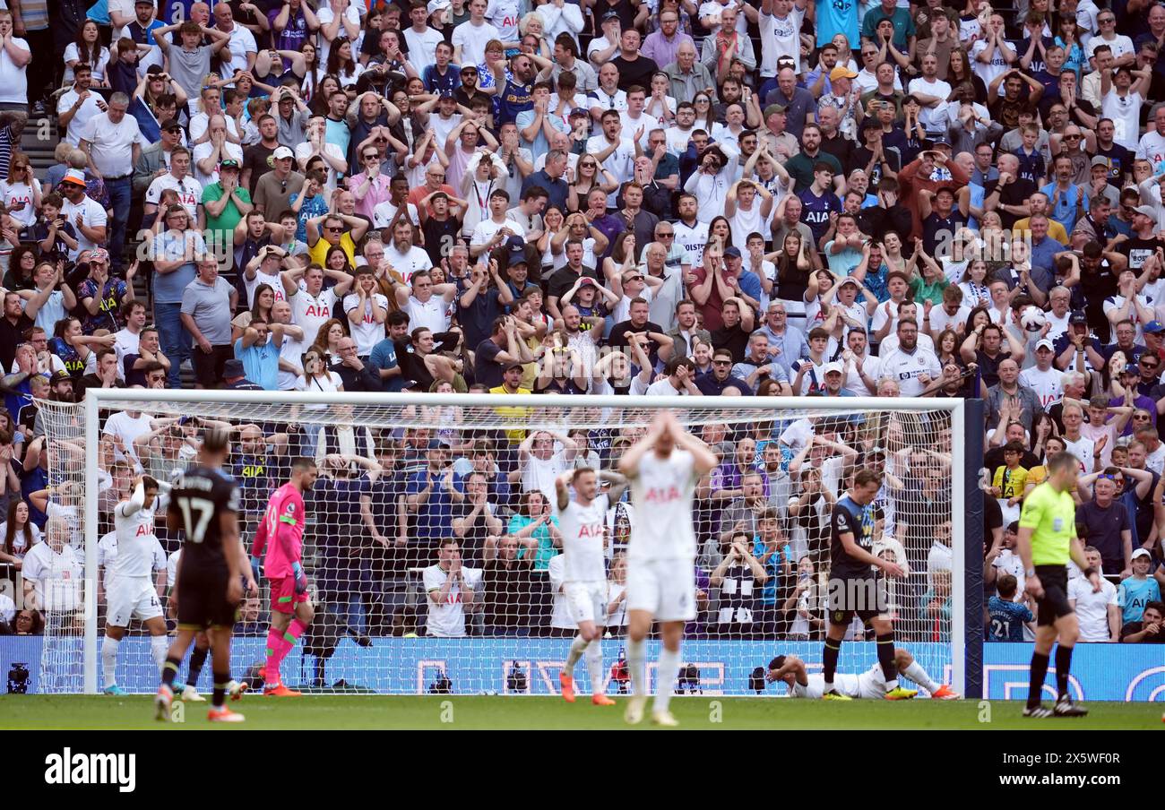 Tottenham Hotspur fans react following a missed chance at goal during ...