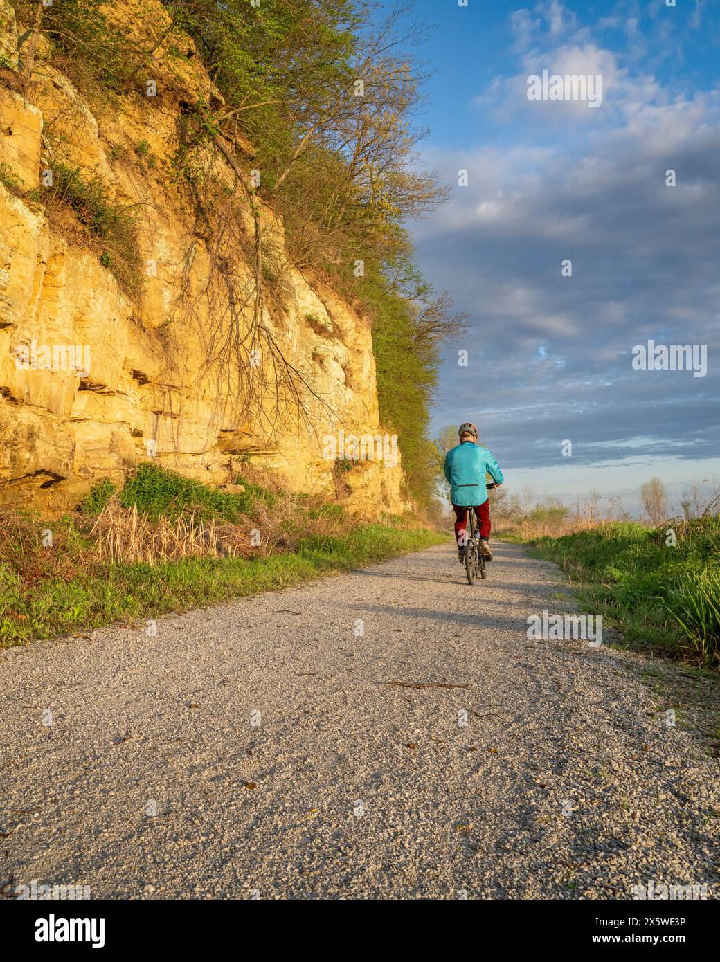 male cyclist riding a folding bike on Steamboat Trace, bike trail ...