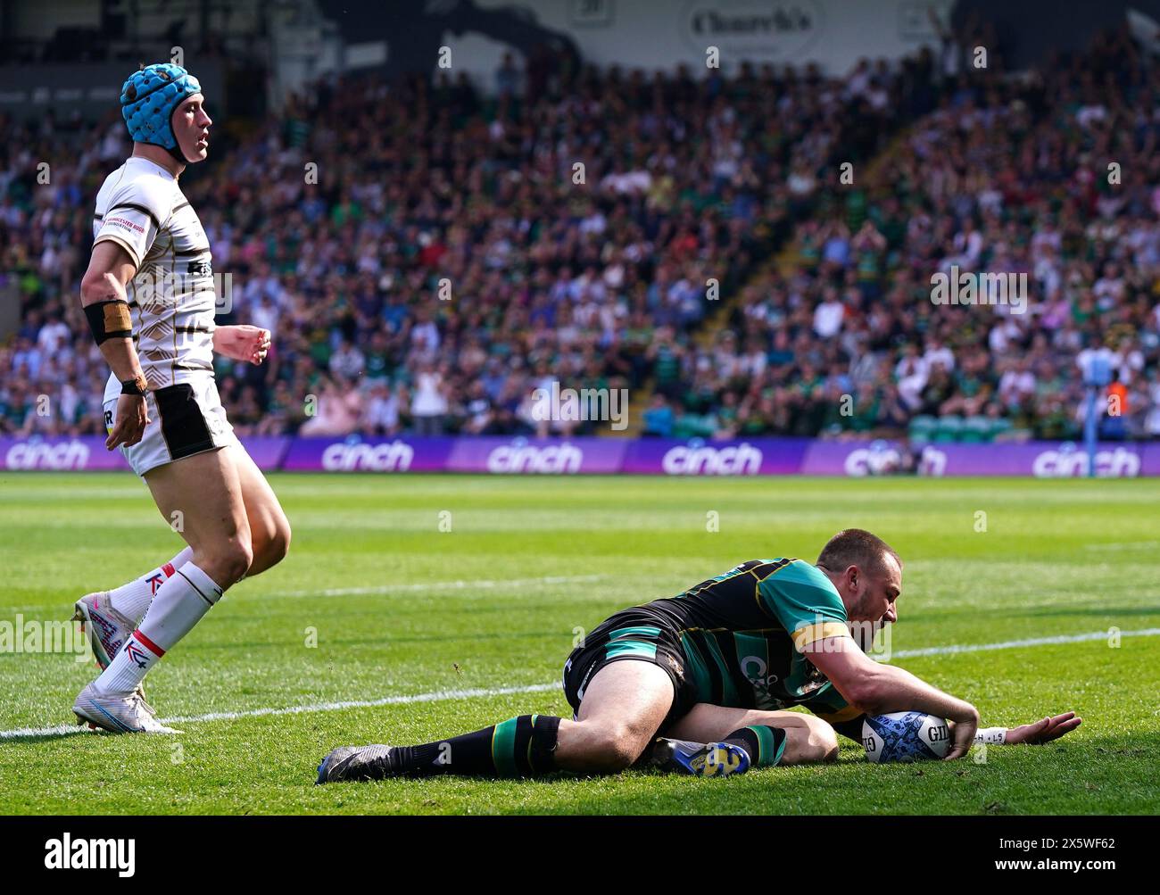 Northampton Saints' Ollie Sleightholme scores a try during the ...