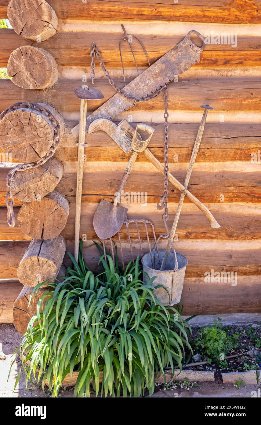 Pioneer tools mounted on wooden cabin wall at the Bluff Fort historic ...