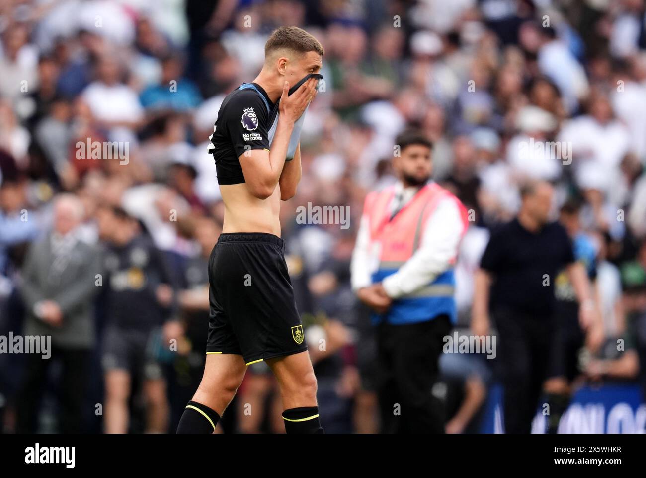 Burnley's Maxime Esteve stands dejected following the Premier League ...