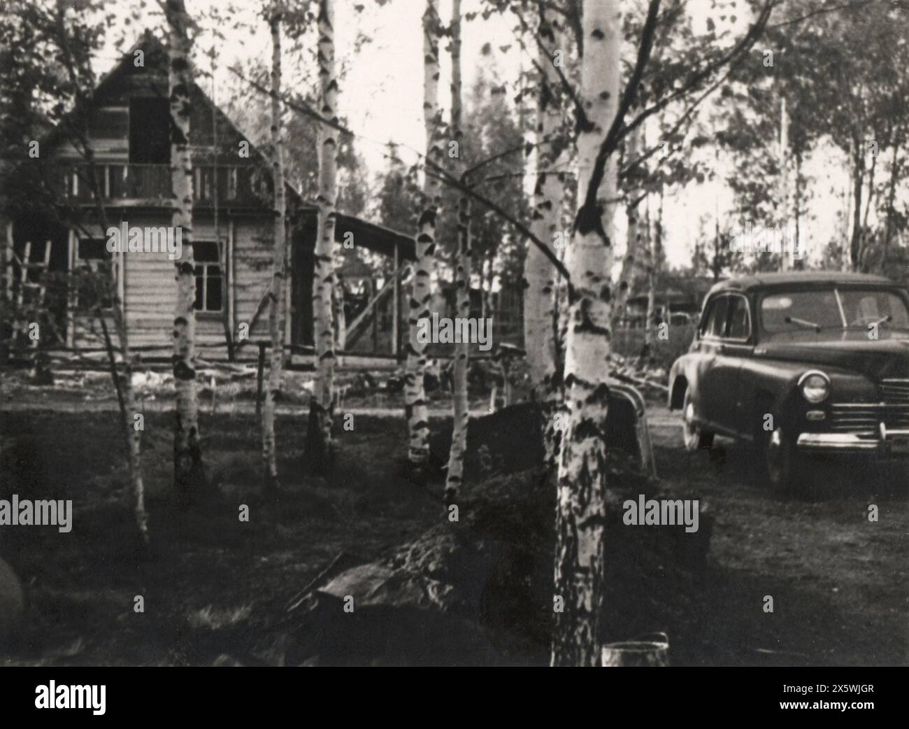 Plank house for summer holiday (dacha) under construction and car ...
