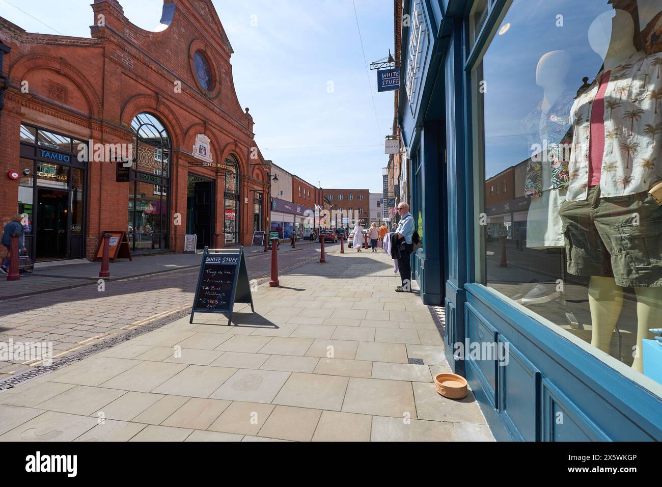 Old man waiting outside a shop Stock Photo - Alamy