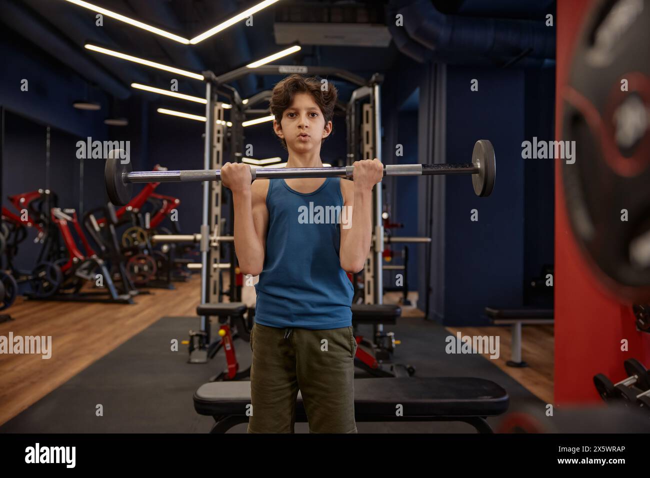 Masculine confident schoolboy enjoying bodybuilding workout Stock Photo ...