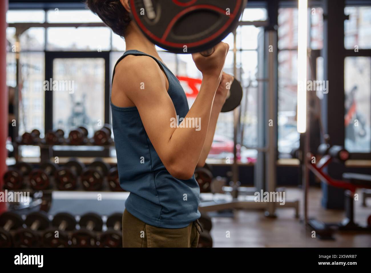 Confident schoolboy enjoying bodybuilding workout Stock Photo - Alamy