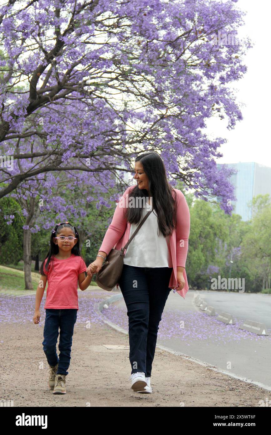 Divorced single mom and 4-year-old Latina brunette daughter walk ...