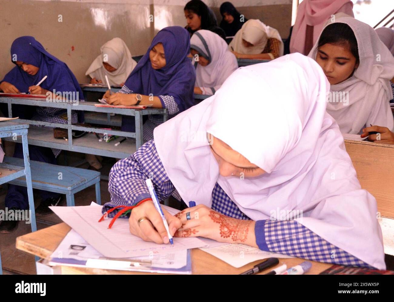 Students of matric class solving paper in examination center during ...