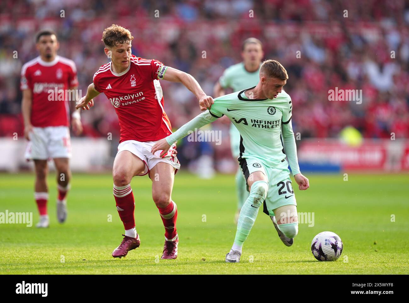 Nottingham Forest's Ryan Yates (left) and Chelsea's Cole Palmer battle ...