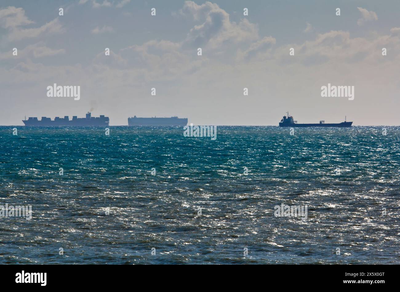 Italy, Sicily, Mediterranean sea, cargo ships and an oil thank in the ...