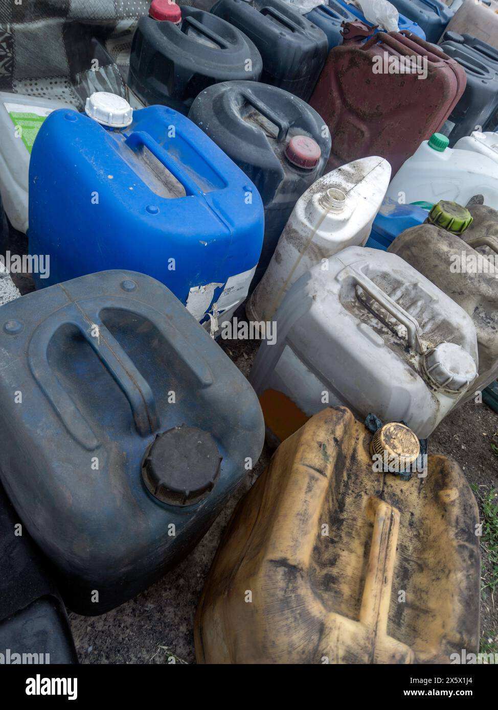 used plastic containers on the ground Stock Photo - Alamy
