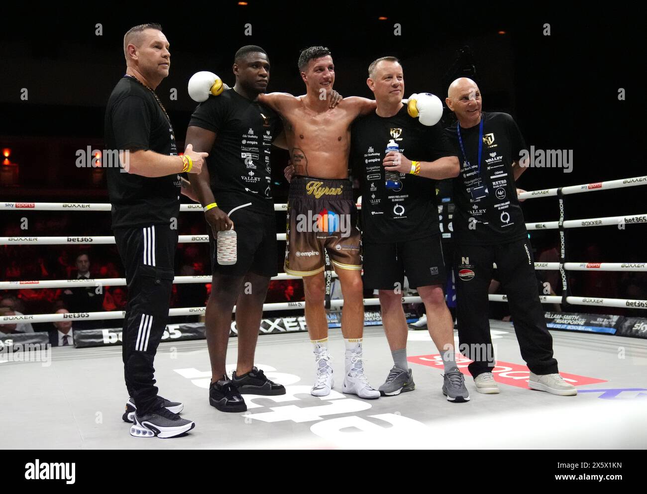 Kyran Jones (centre) celebrates victory against Lewis Howells (not ...