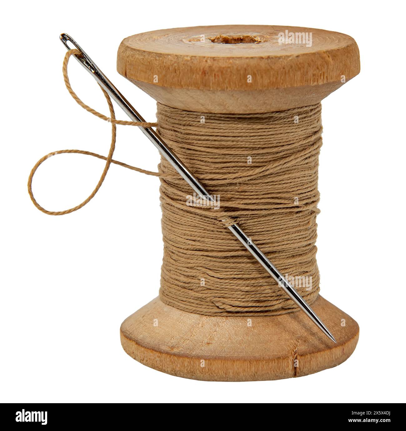Old wood spool of thread and needle on a white background. Sewing ...