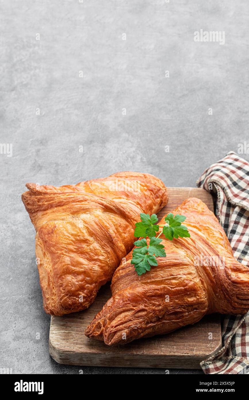 Puff pastry triangles filled with apples on gray background Stock Photo ...