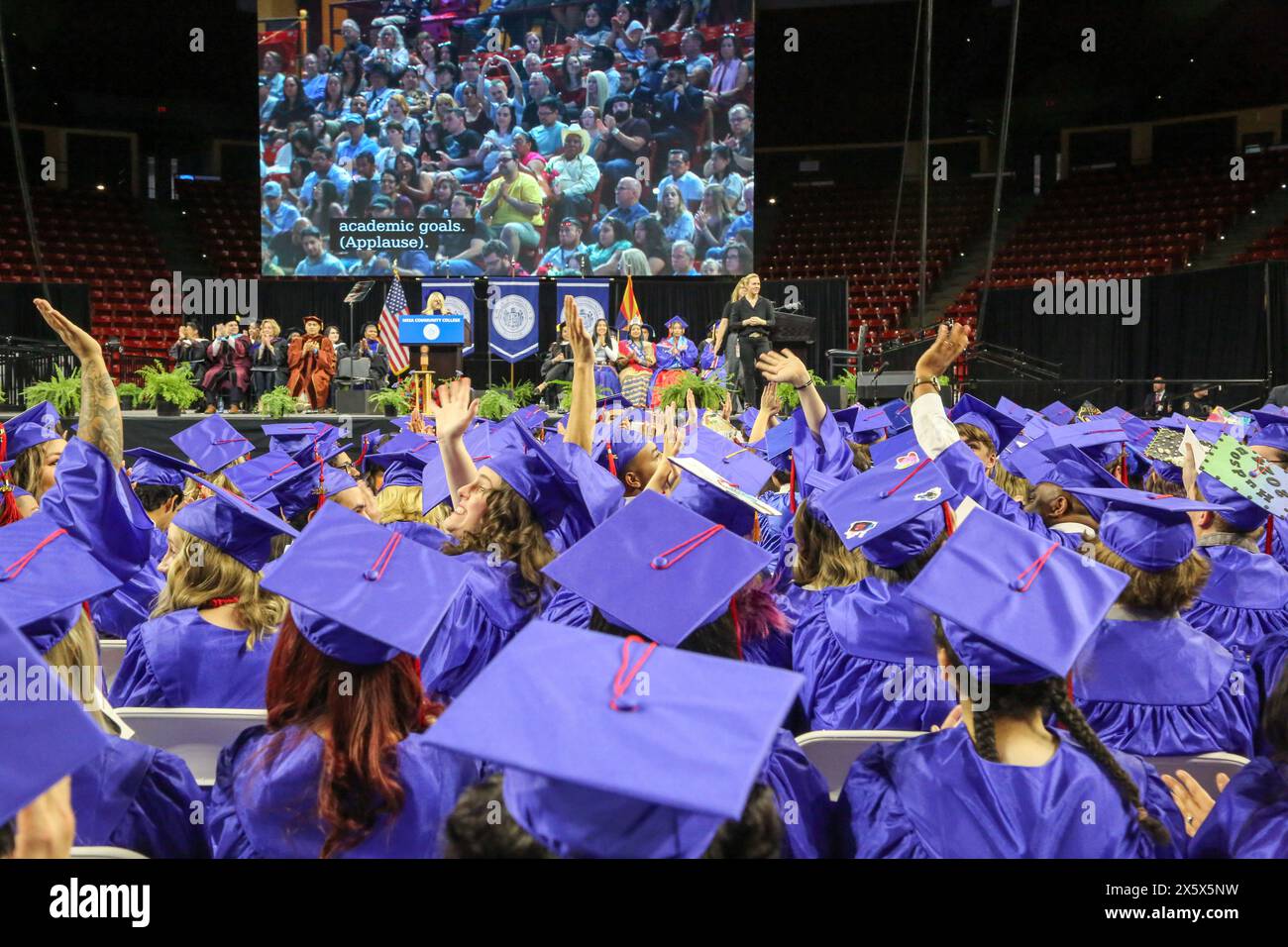 The graduating class of 2024 stands up and applauds at Mesa Community ...